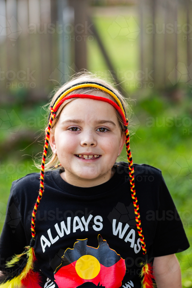 Image of Seven year old Aboriginal Worimi girl portrait in backyard ...
