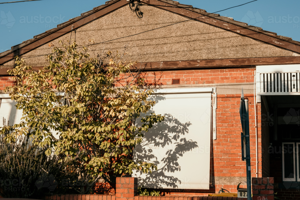 Image of Shadows on a house front. - Austockphoto