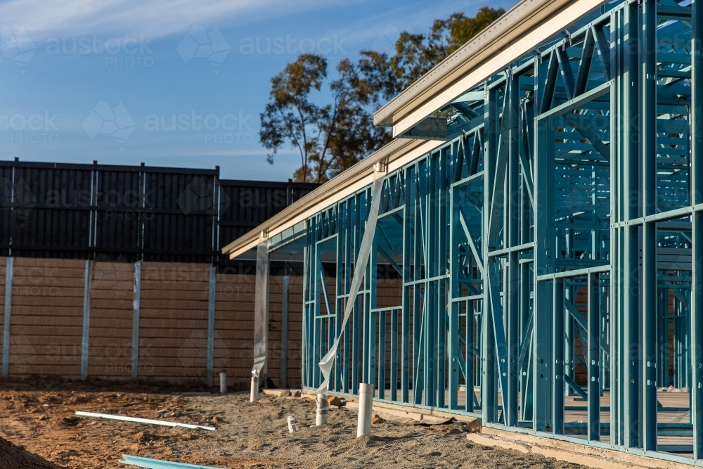 Image of side of a house being built with a steel frame - Austockphoto
