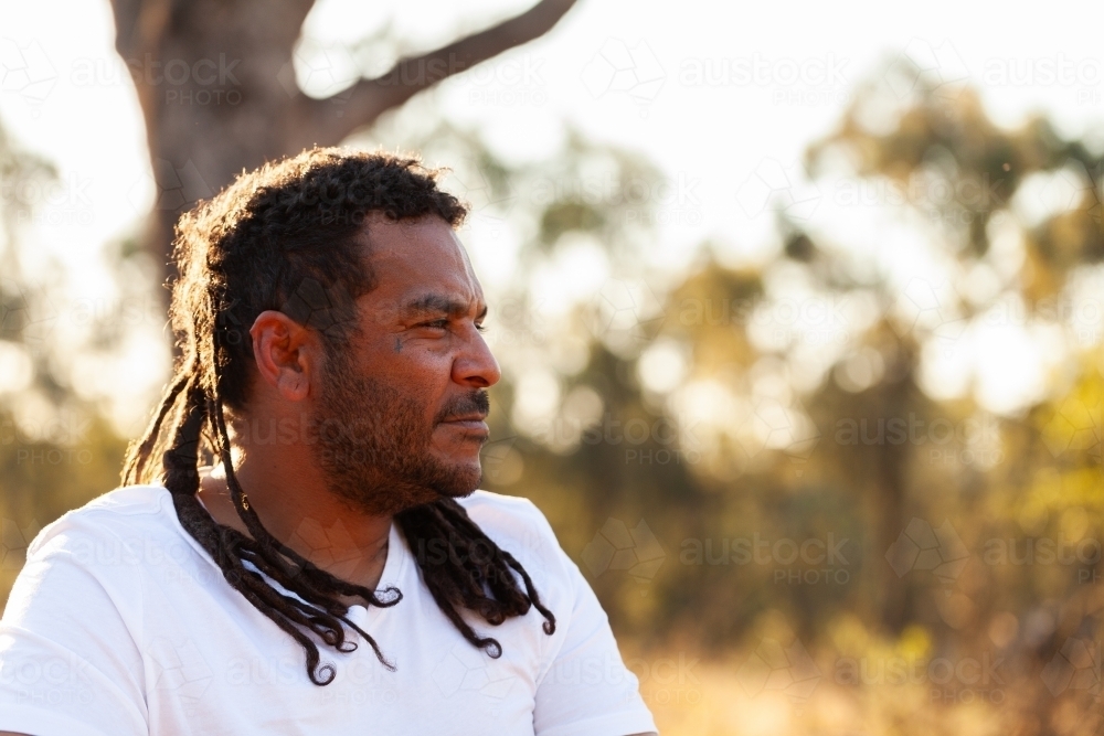 Image of Side profile portrait of aboriginal man looking away with ...