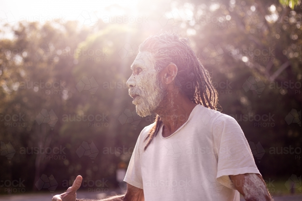 Image of Side profile portrait of aboriginal man with sun flare ...