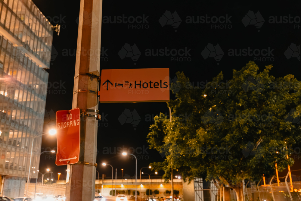 Image of Sign leading to hotels for walking traffic along footpath at ...