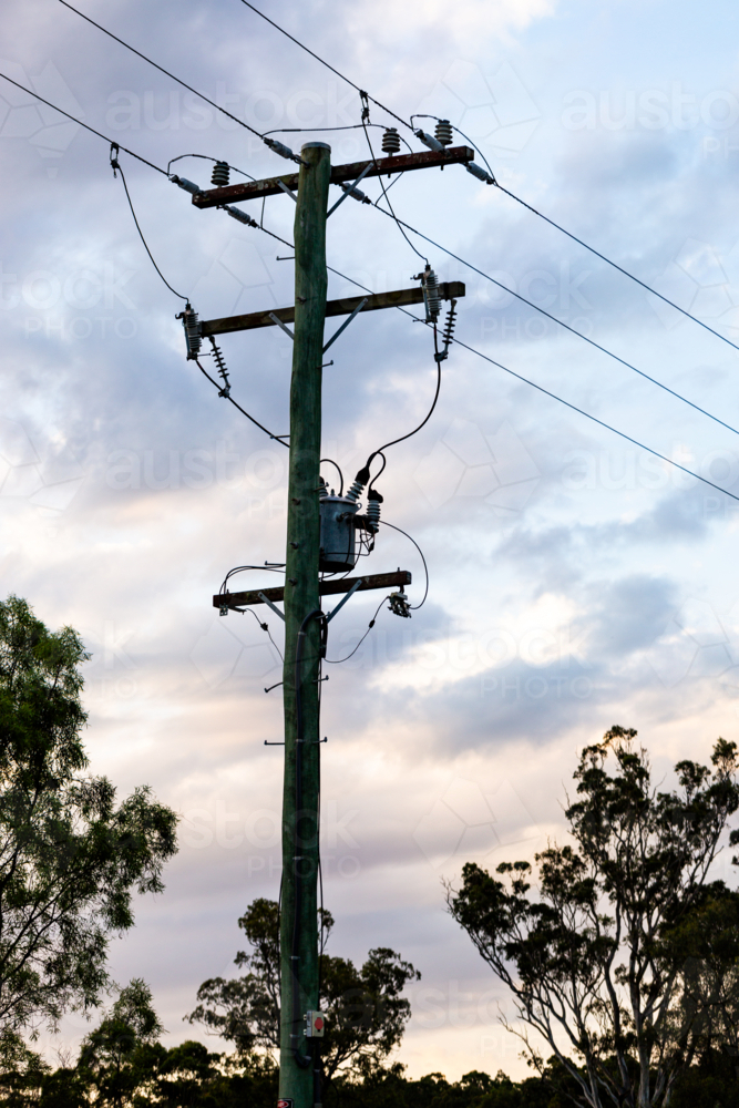 Image of Silhouette of powerline and power pole - Austockphoto