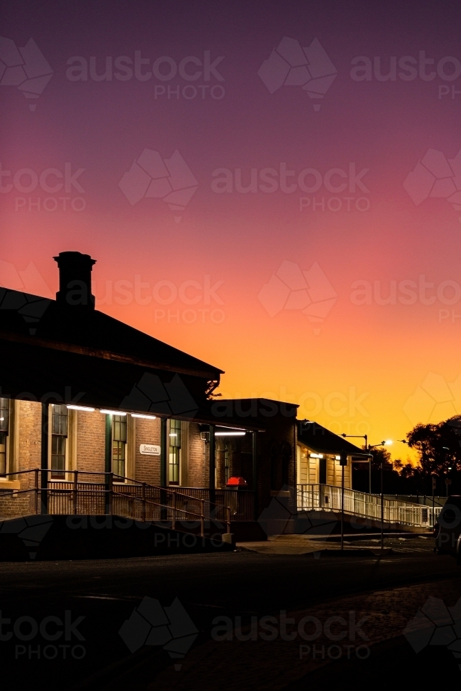 Image of Silhouette of train station at dusk in Singleton - Austockphoto