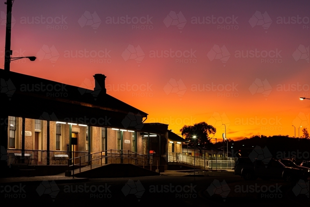 Image of Silhouette of train station at dusk in Singleton - Austockphoto