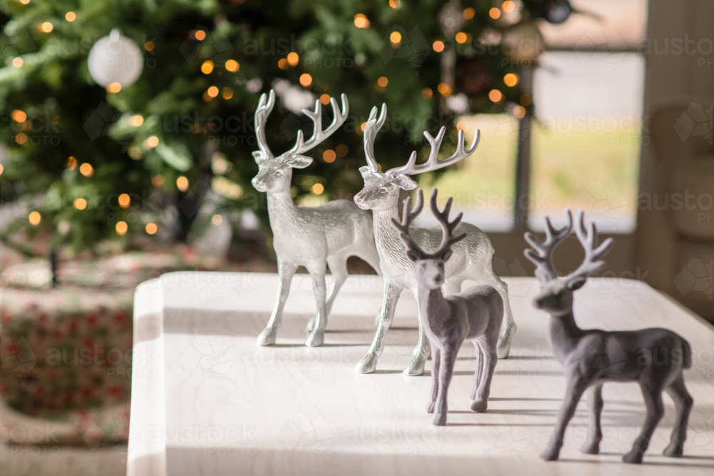 Image of silver and grey reindeer figurines stands gracefully on a ...