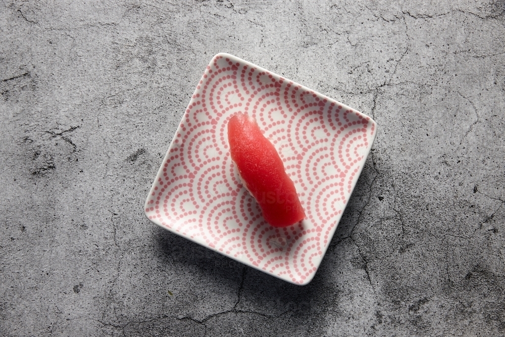 Image of Single nigiri on square plate - Austockphoto