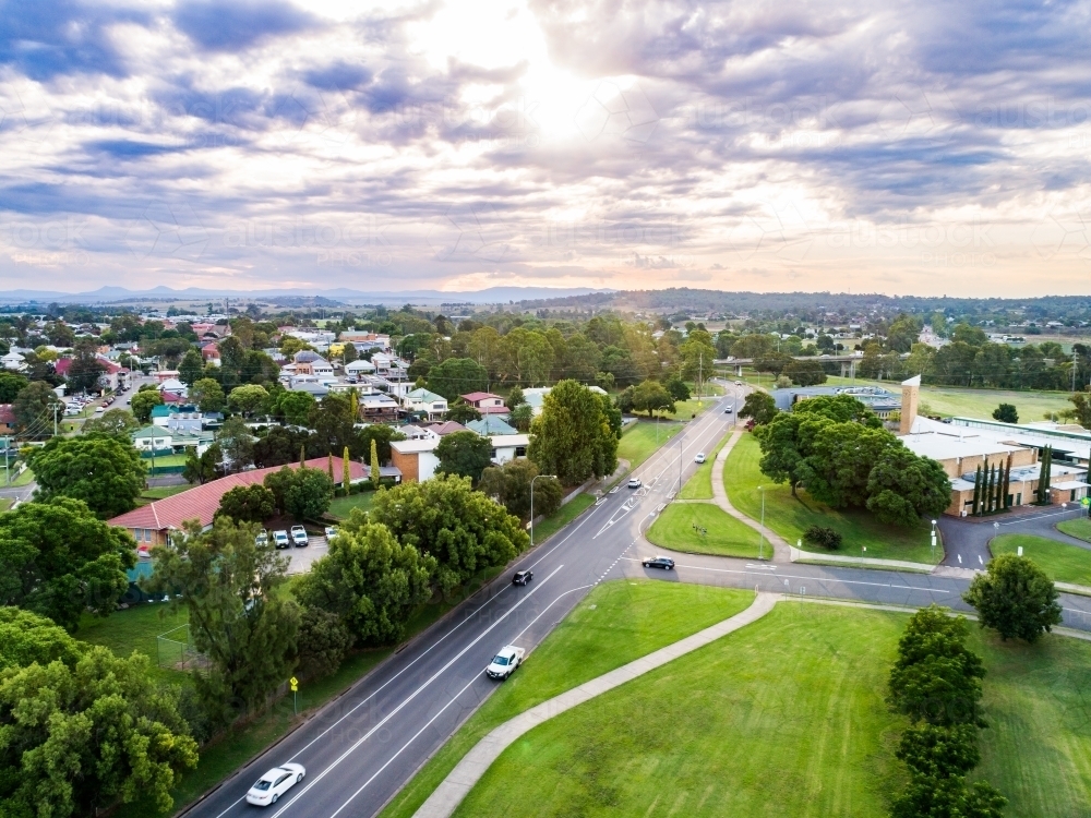 Image of Single ray of light shining down over town of singleton on ...