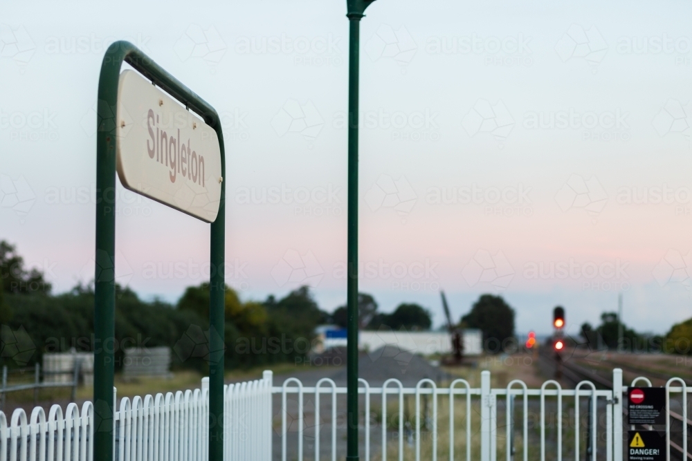 Image of Singleton train station sign in dawn light at early commute ...