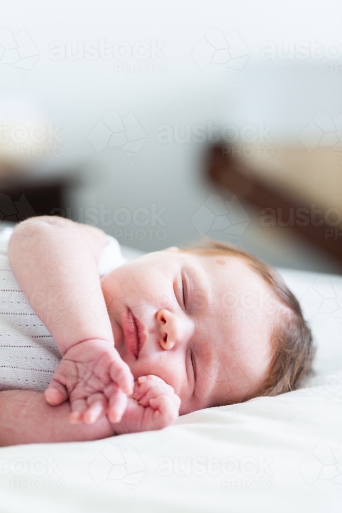 Image of Sleeping newborn baby hands detail - Austockphoto