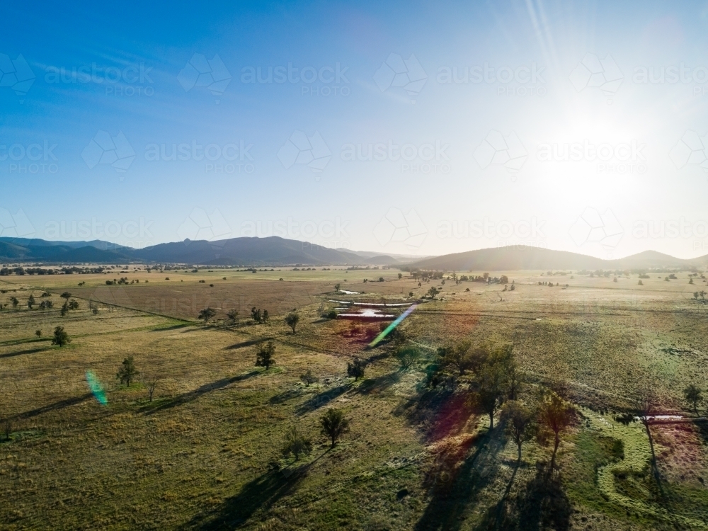 Image of Small bendy watercourse creek winding through pastoral farm ...