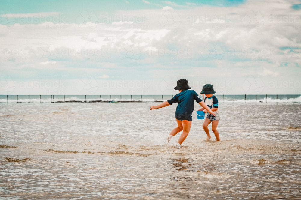 Image of Small children playing in shallow water of the Newcastle Canoe ...