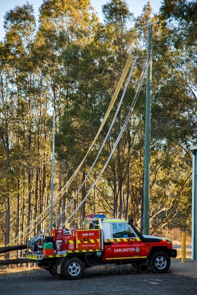 Image of Small country fire truck parked at rural fire station ready ...