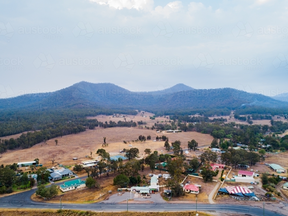Image of Small town of Bulga covered in smoke haze from backburning ...