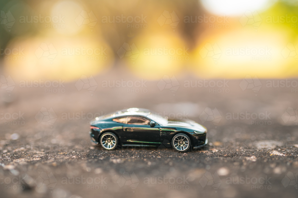 Image of Small toy car close up outdoors with bokeh background ...