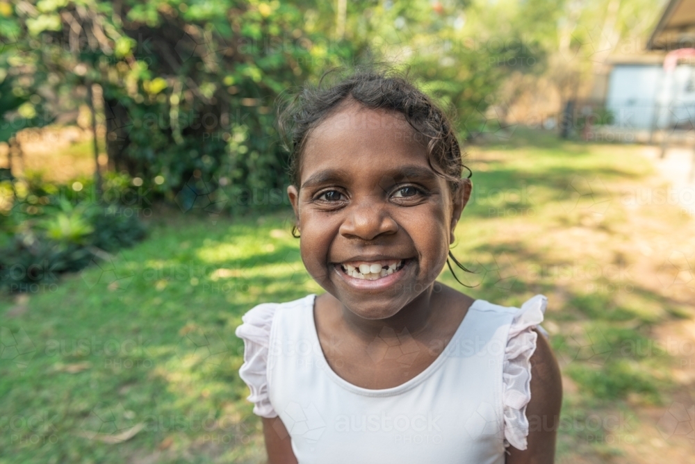 Image of Smiling aboriginal girl wearing ballet dress - Austockphoto