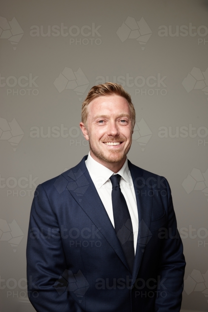 Image of smiling middle aged man wearing suit and tie - Austockphoto