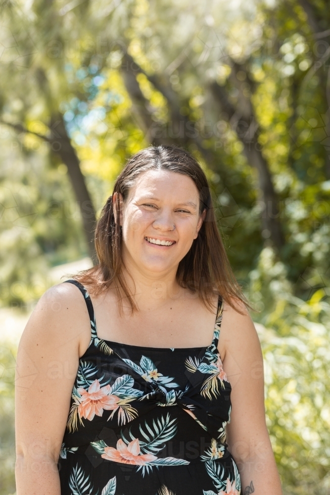 Image of Smiling portrait of a tall happy woman outside in summer ...