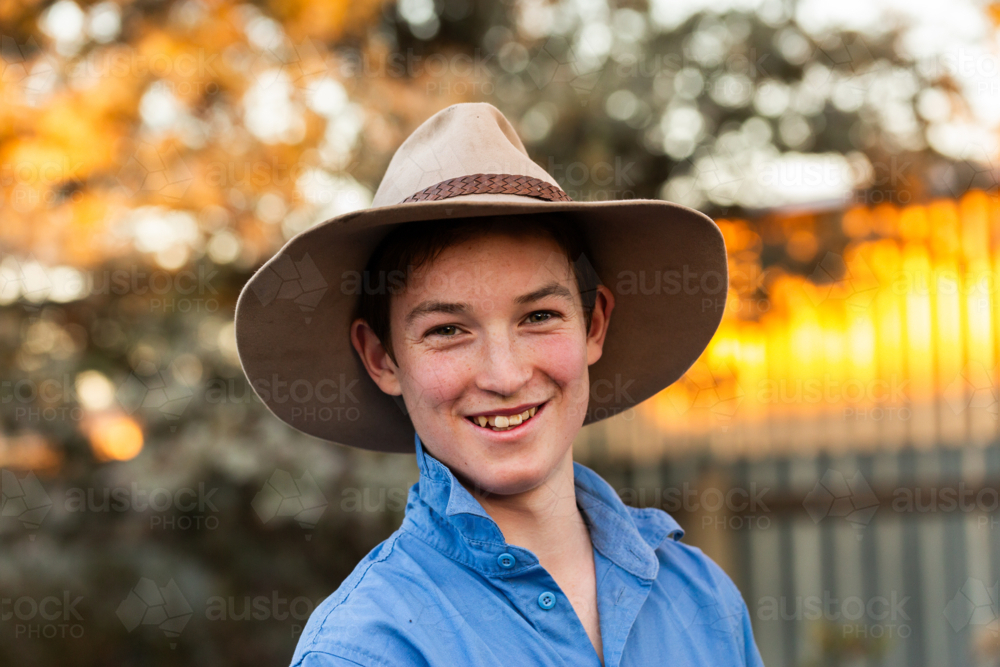 Image of Smiling portrait of happy aussie teenager wearing akubra style ...