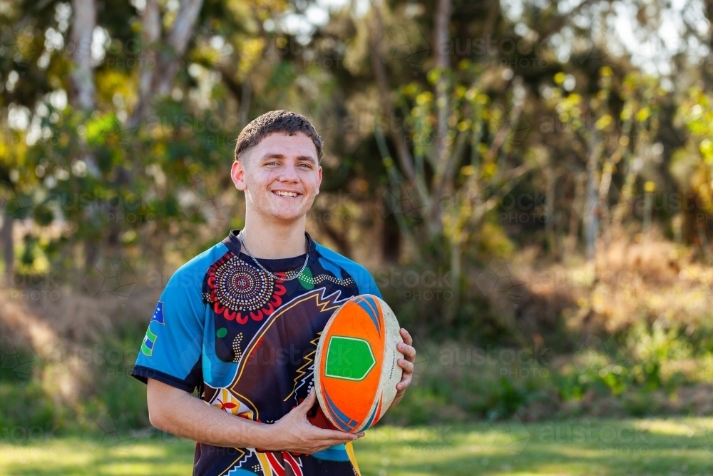 Image of Smiling portrait of happy teenage Australian footy sports ...
