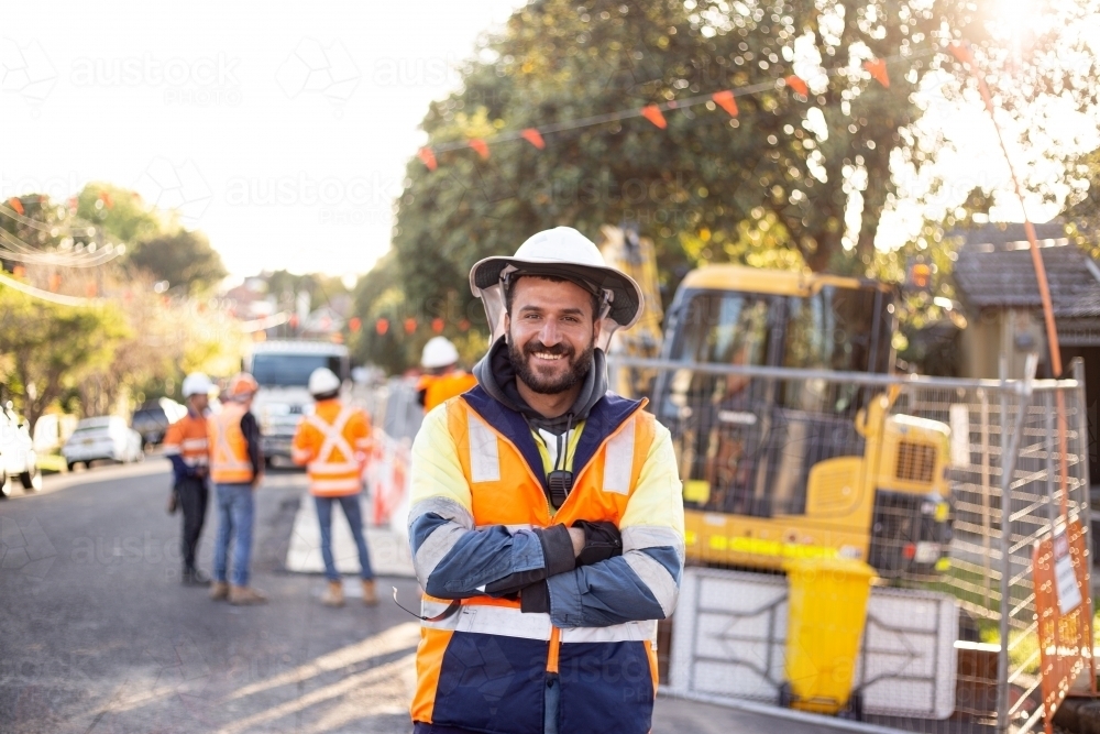 Image of Smiling road worker man with beard wearing wearing high-vis ...