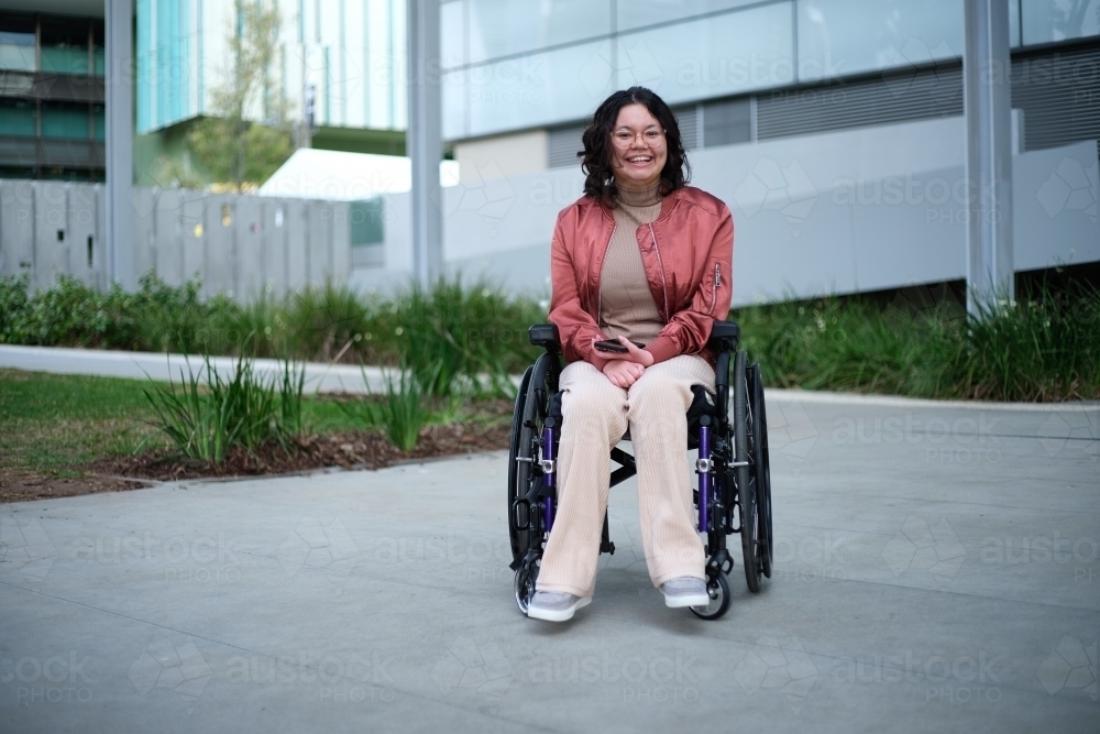 Image Of Smiling Woman With A Disability Sitting In A Wheelchair image-of-smiling-woman-with-a-disability-sitting-in-a-wheelchair