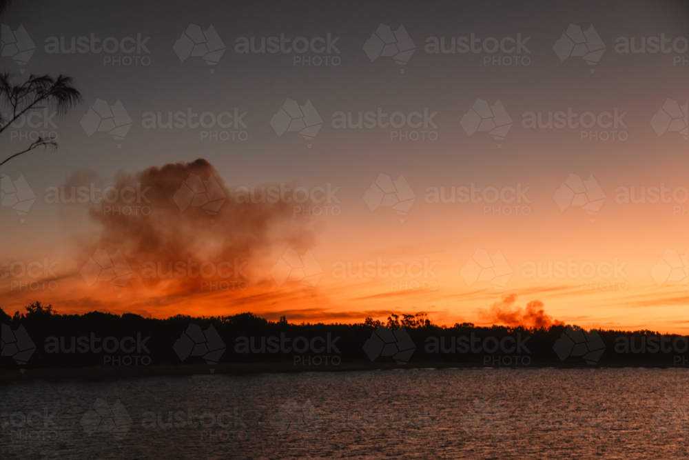 Image of Smoke on the horizon from sugar cane burning at sunset near ...