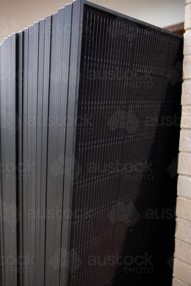 Image of solar panels stacked up ready to install - Austockphoto