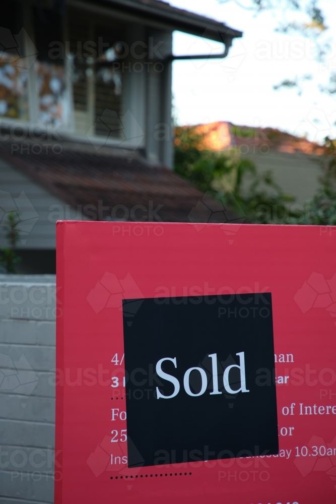 Image of Sold banner in front of the house - Austockphoto