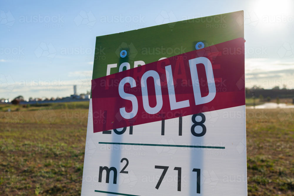 Image of Sold sign on empty lot in new housing development area on the ...