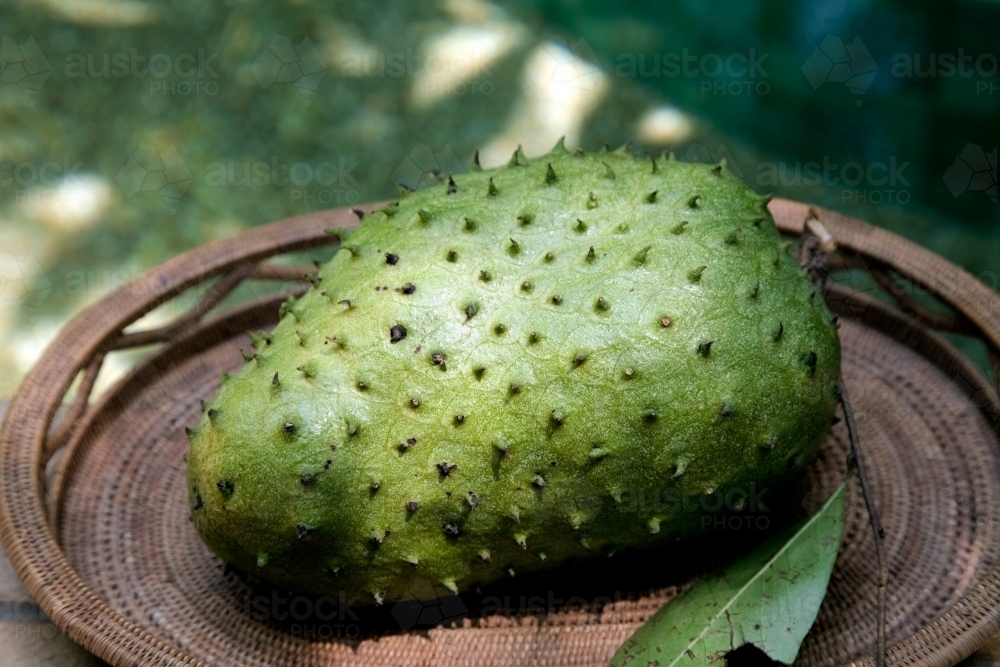 Image of Soursop fruit on a plate - Austockphoto