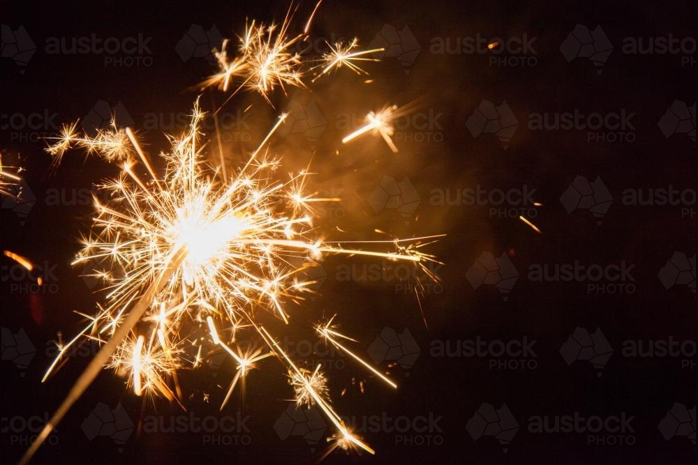 Image of Sparkler shooting out sparks - Austockphoto
