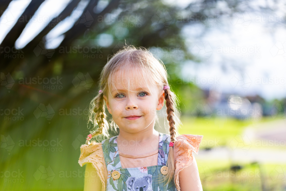 Image of Sparkling rainbow light beside happy young Aussie child ...