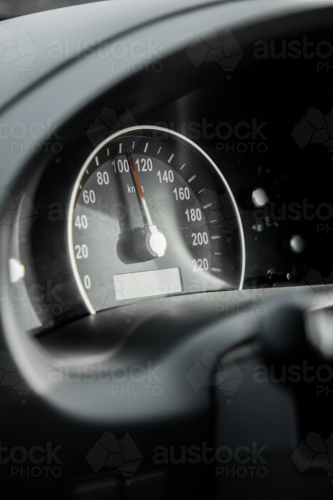 Image of Speedo and dashboard of car on the road - Austockphoto