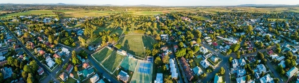 Image of Sports ground, tennis club and football oval beside golf ...
