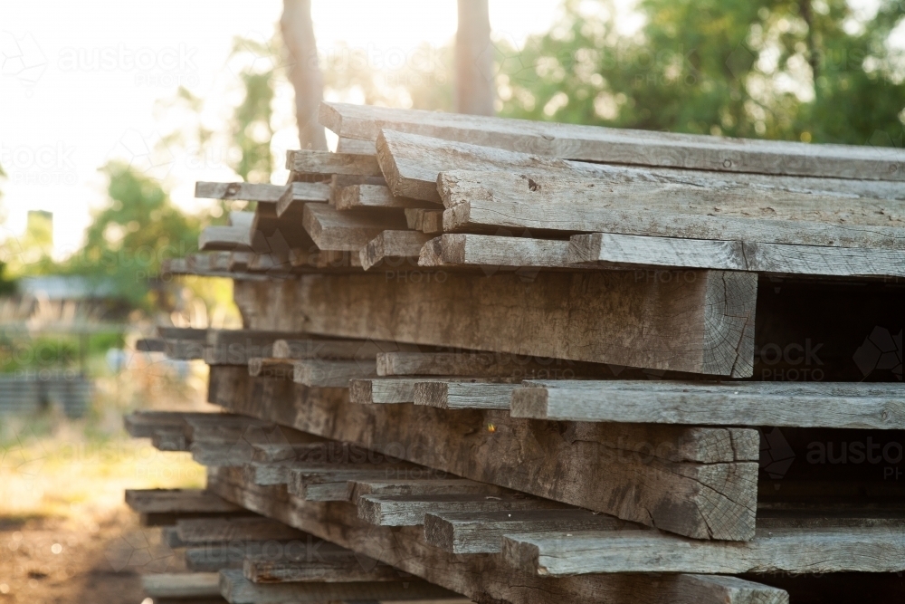 Image of Stack of old pallets on a farm - Austockphoto
