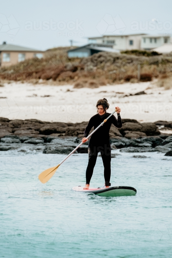 Image of Stand up paddling - Austockphoto