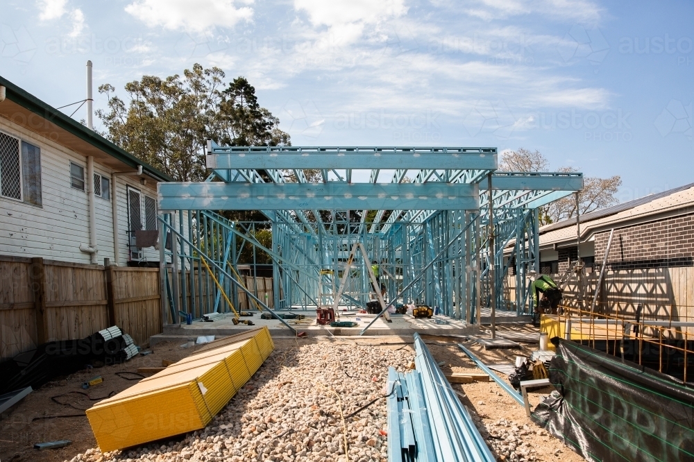 Image of steel framed house getting built on a suburban block ...