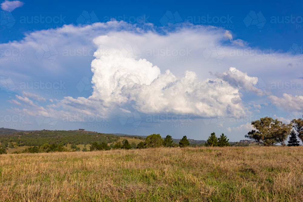 Image of Storm clouds forming over rural Australian landscape ...