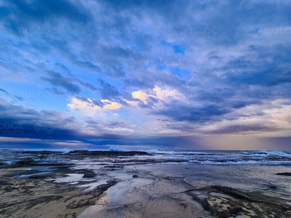 Image of Storm clouds forming over the beach at Norah Head on the NSW ...