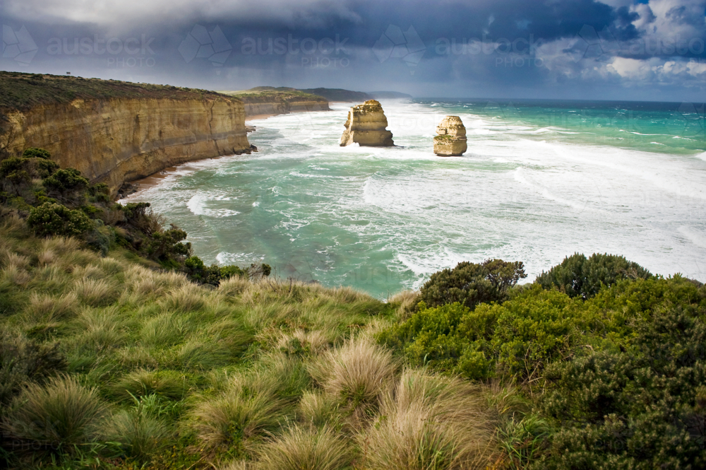 Image of Stormy coastal view with cliffs, ocean waves, and sea stacks ...