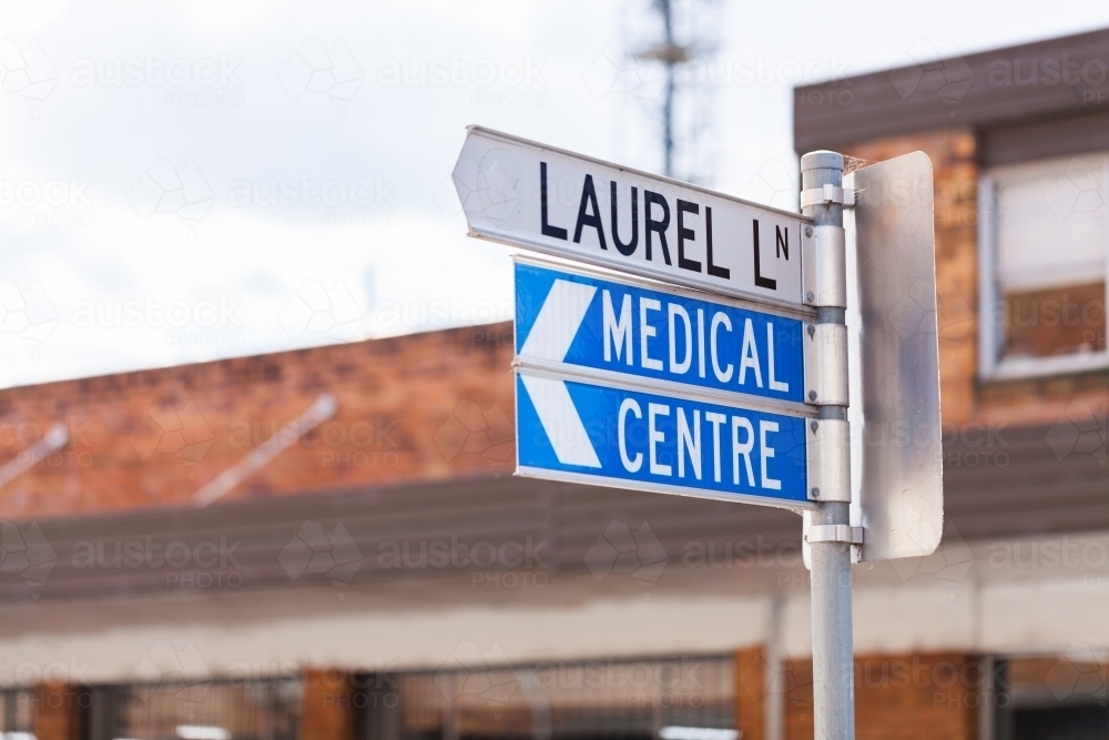 Image of Street road sign to medical centre down laurel lane - Austockphoto