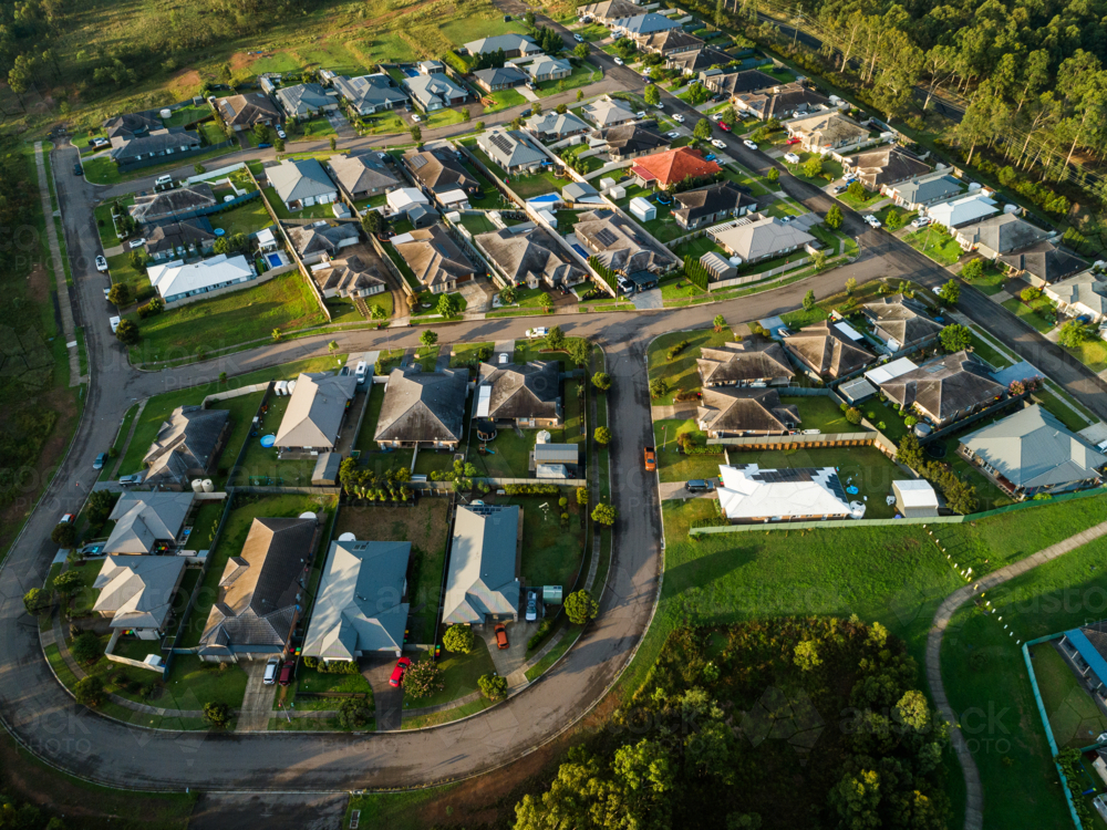 Image of Streets and houses in new suburb at the edge of country town ...