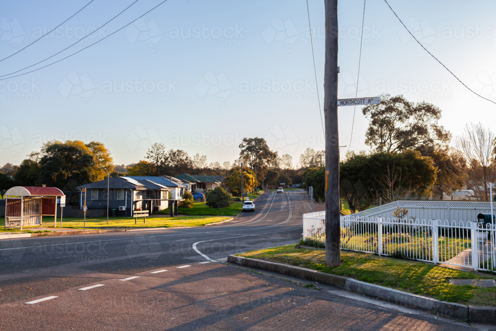Image of streetscape of residential area of country town at sunset ...