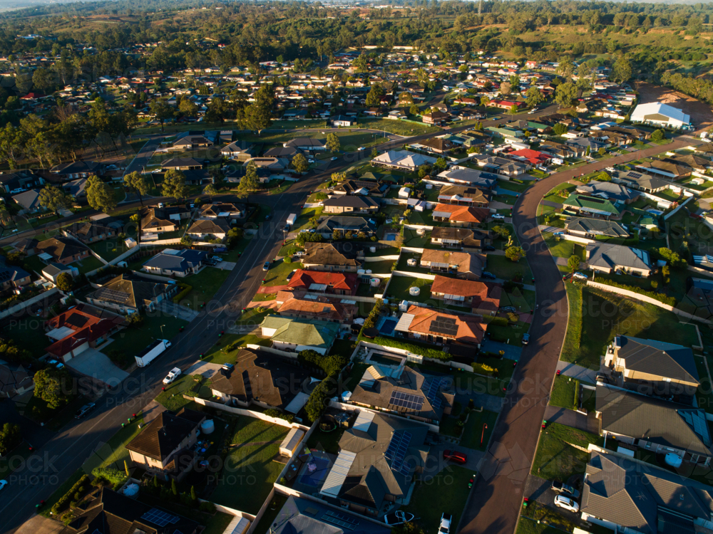 Image of Suburban houses on bin day with bins beside road seen from ...