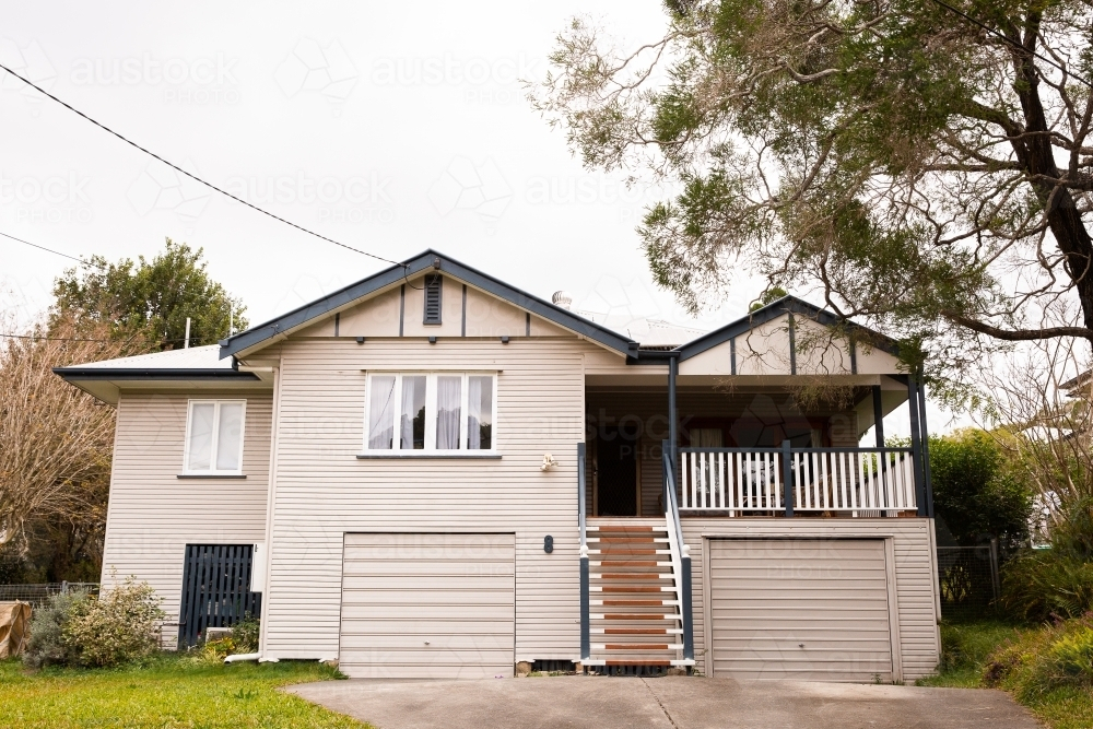 Image of suburban post war home in Brisbane with garages underneath ...