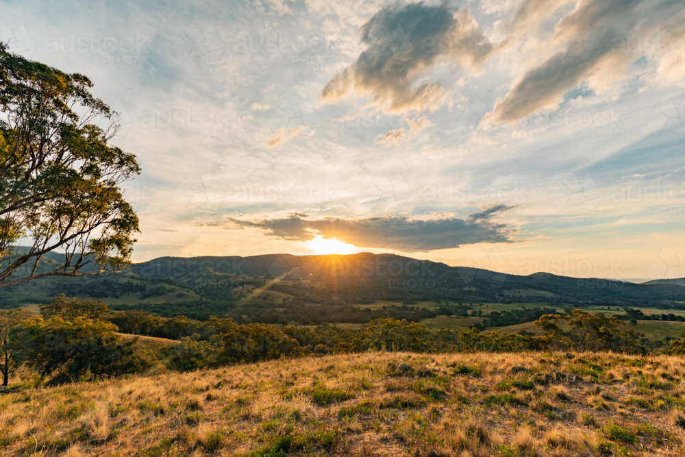 Image of Sun setting behind distant hills in regional New South Wales ...