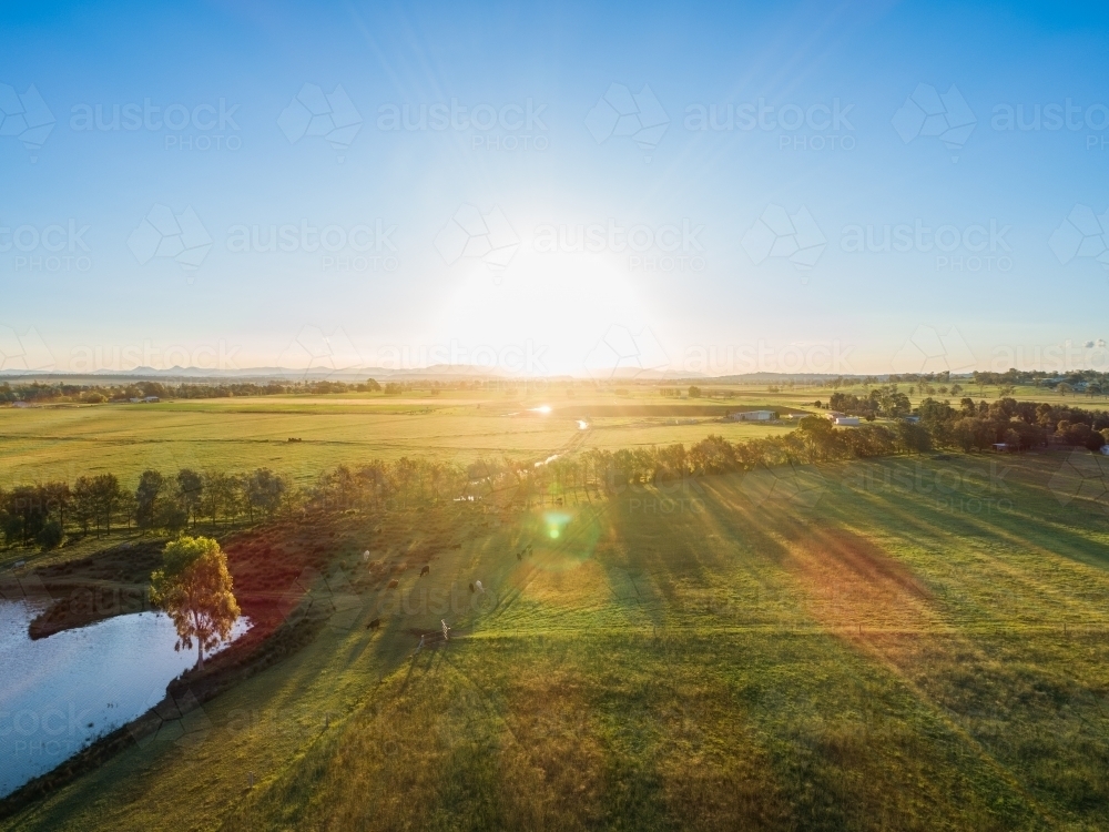 Image of Sun setting in blue sky over rural Australian agricultural ...