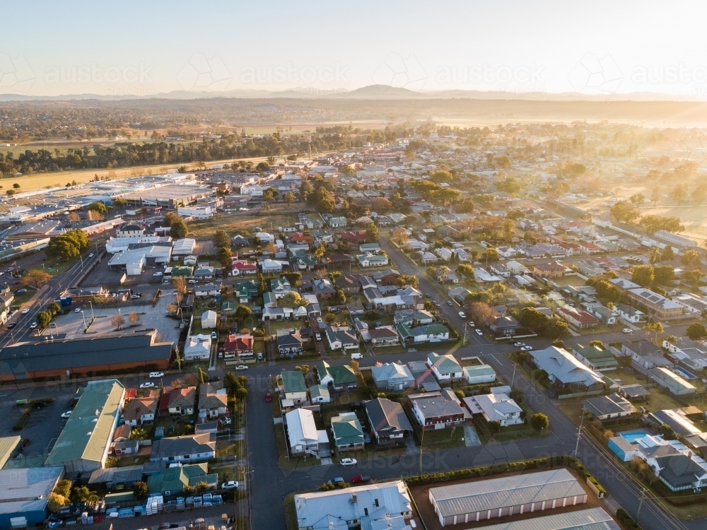 Image of sunlight over streets in country town of Singleton on misty ...