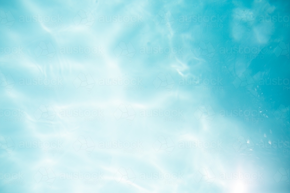 Image of Sunlight ripples on pool water - Austockphoto